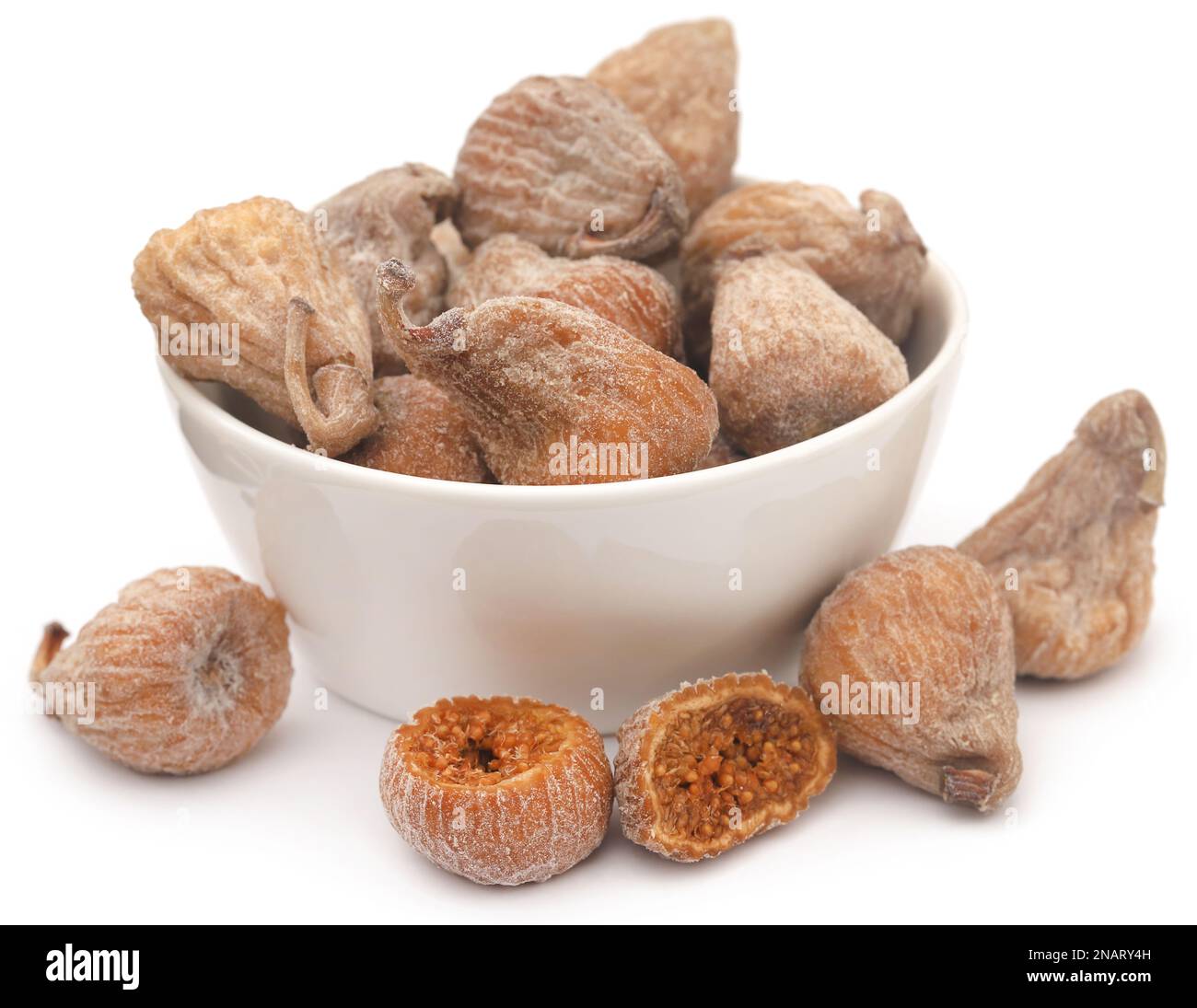 Dried fig in a bowl over white background Stock Photo - Alamy
