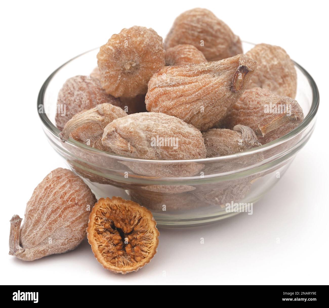 Dried fig in a bowl over white background Stock Photo - Alamy