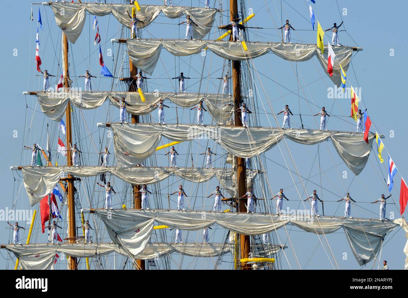 Cadets stand on the sail yards of the Mexican navy tall ship Cuauhtemoc ...