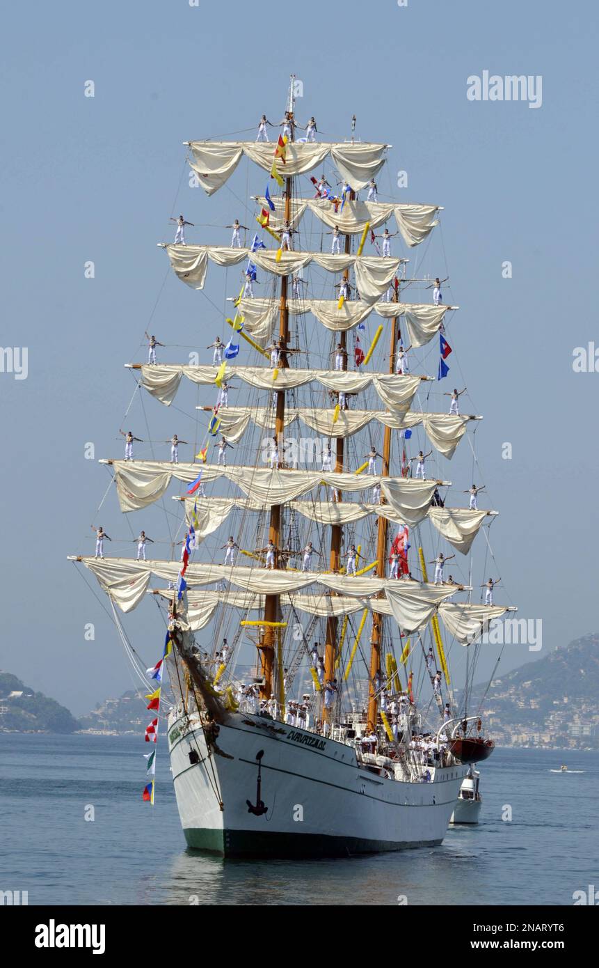 Cadets stand on the sail yards of the Mexican navy tall ship Cuauhtemoc ...