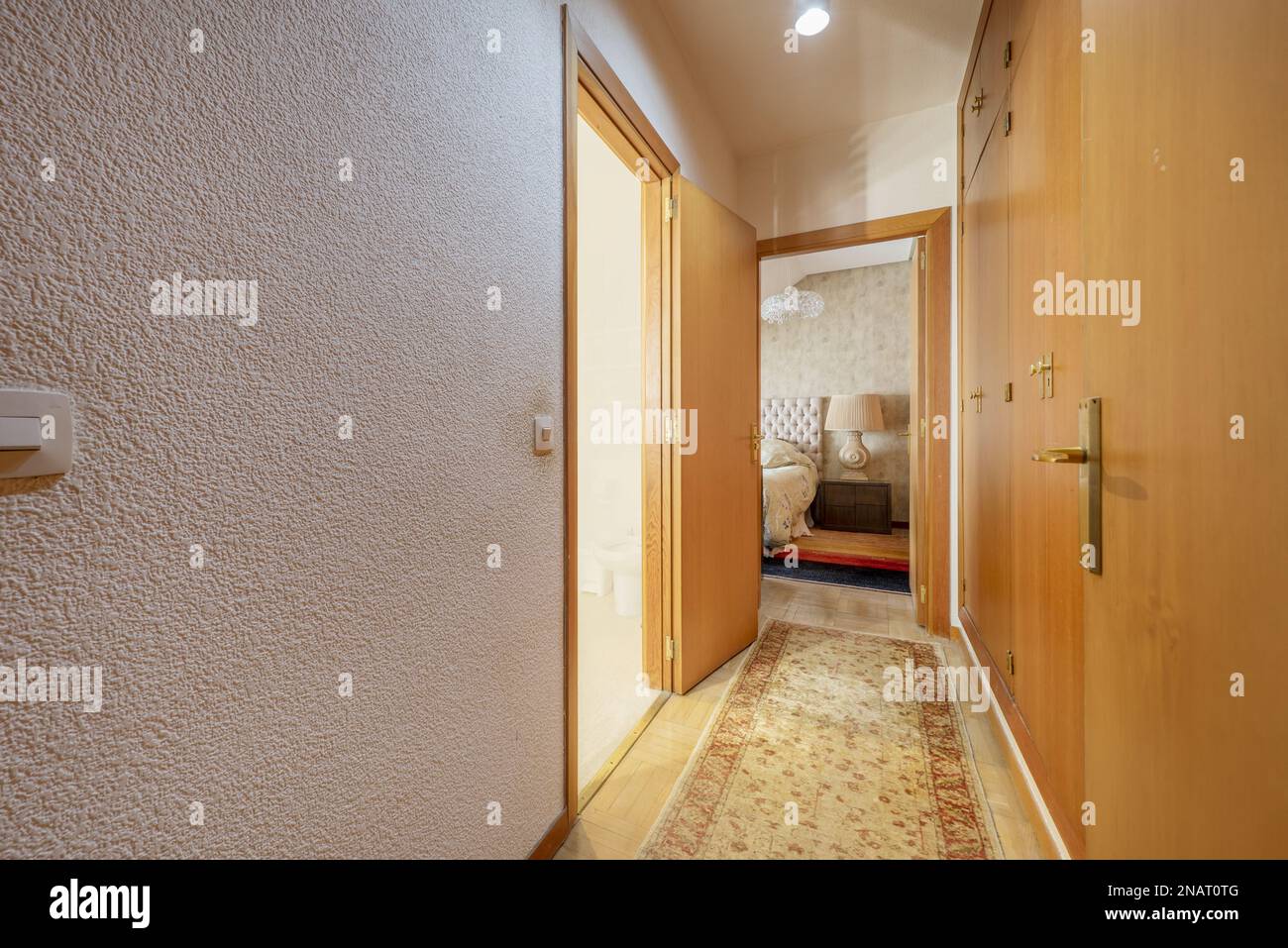 Corridor of a house with white painted walls with gotelet, classic ...