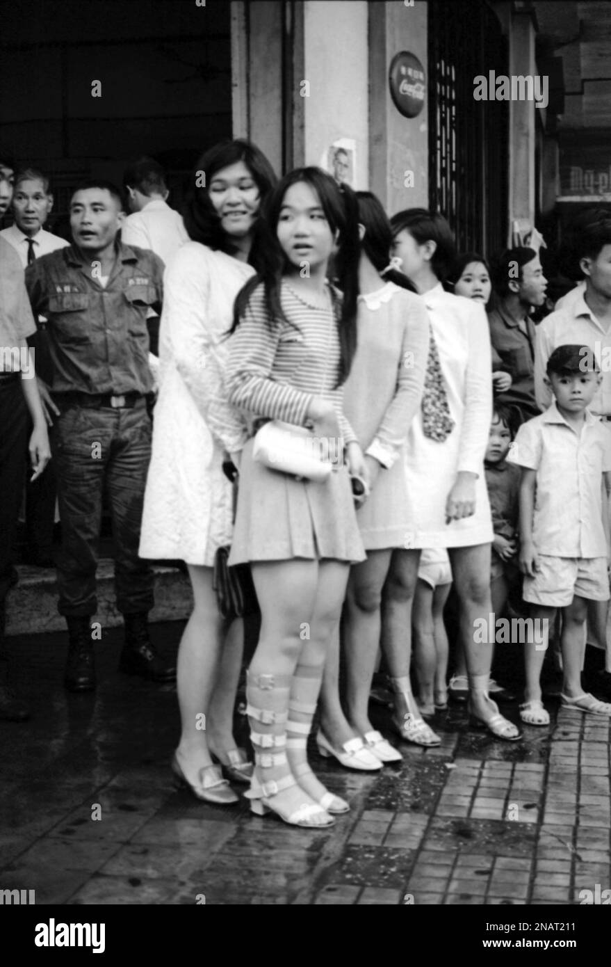 Vietnamese girls waiting out the monsoon in Saigon on May 30, 1968. (AP ...