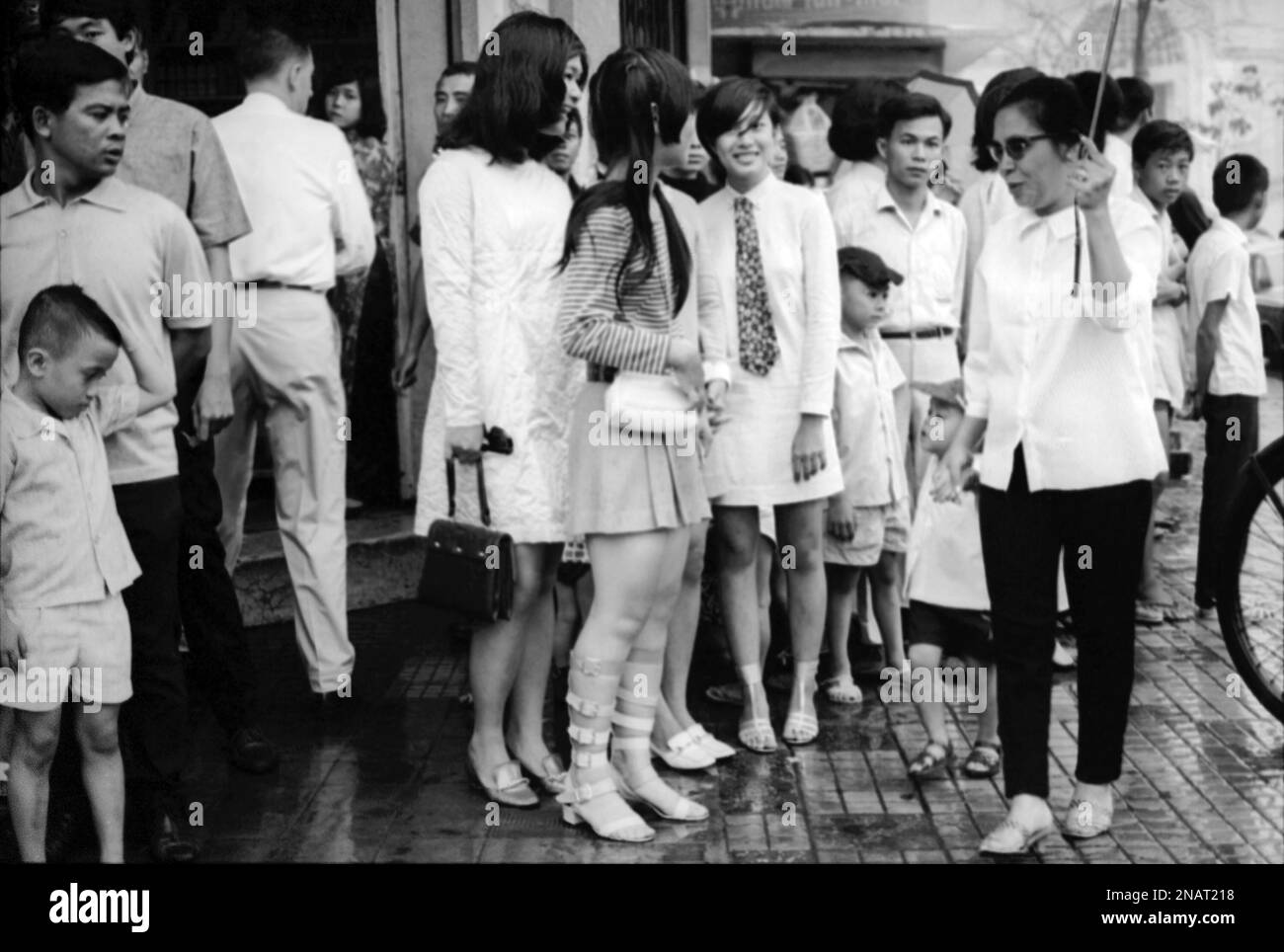 Vietnamese girls waiting out the monsoon in Saigon on May 30, 1968. (AP ...