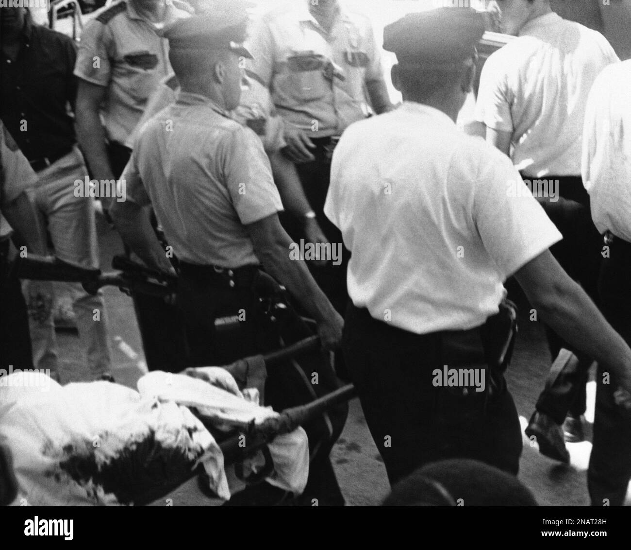 Police carry the covered body of Charles J. Whitman from the Univ. of ...