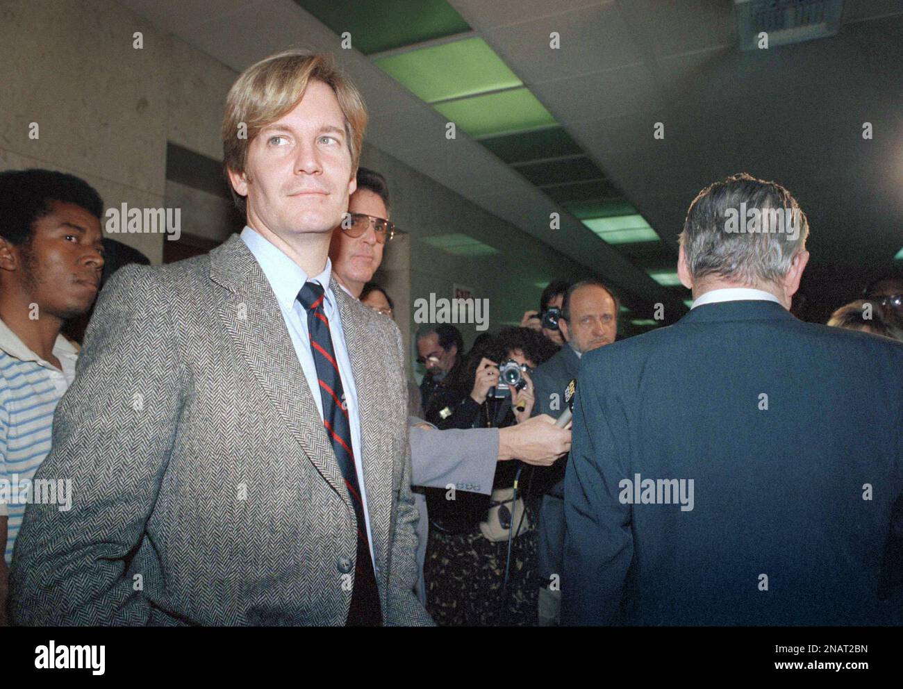 Ignoring the press, Marc Christian, left, waits while his lawyer Harold ...