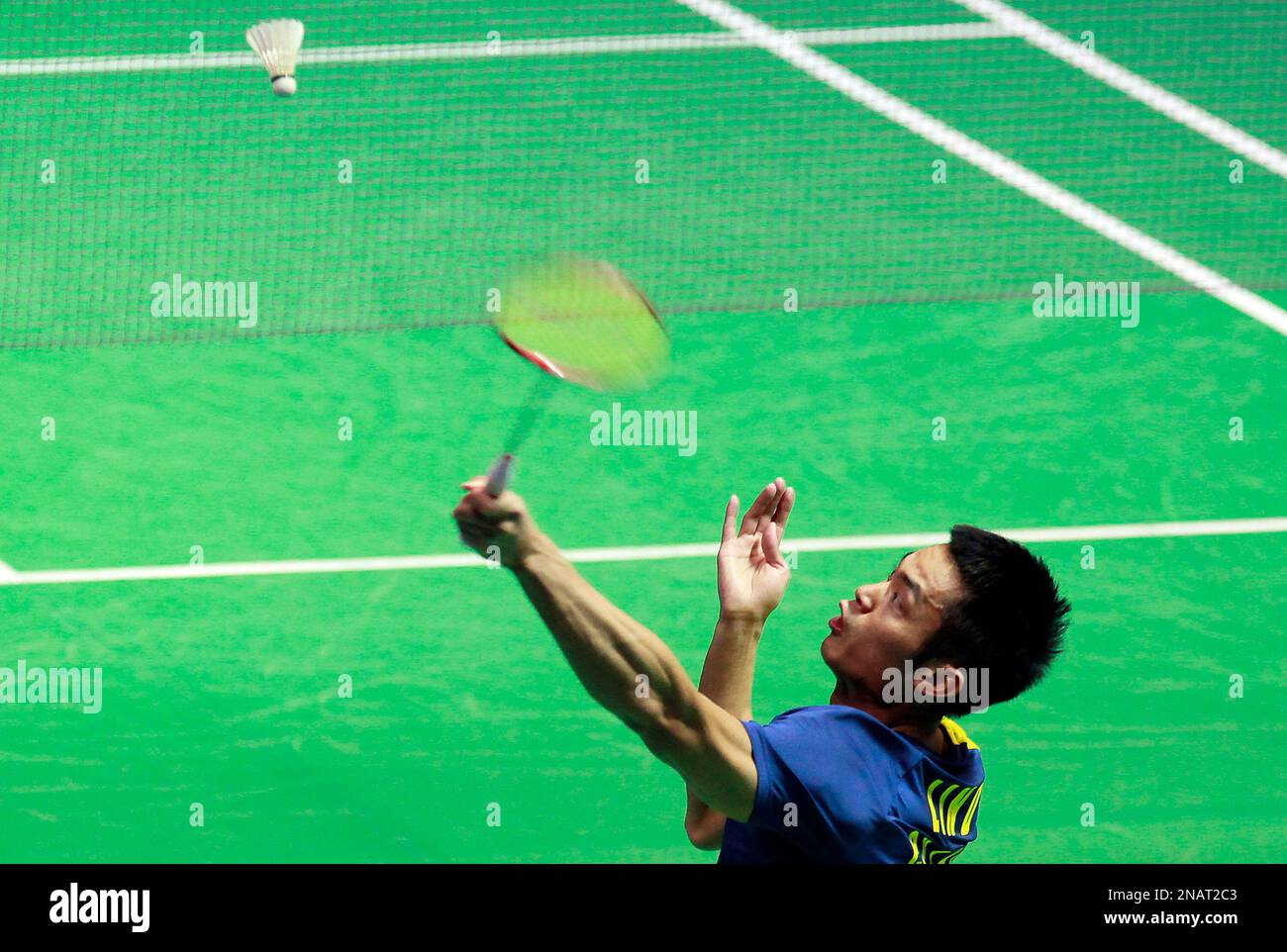 China's Lin Dan returns the shot against Hong Kong's Yan Kit Chan ...