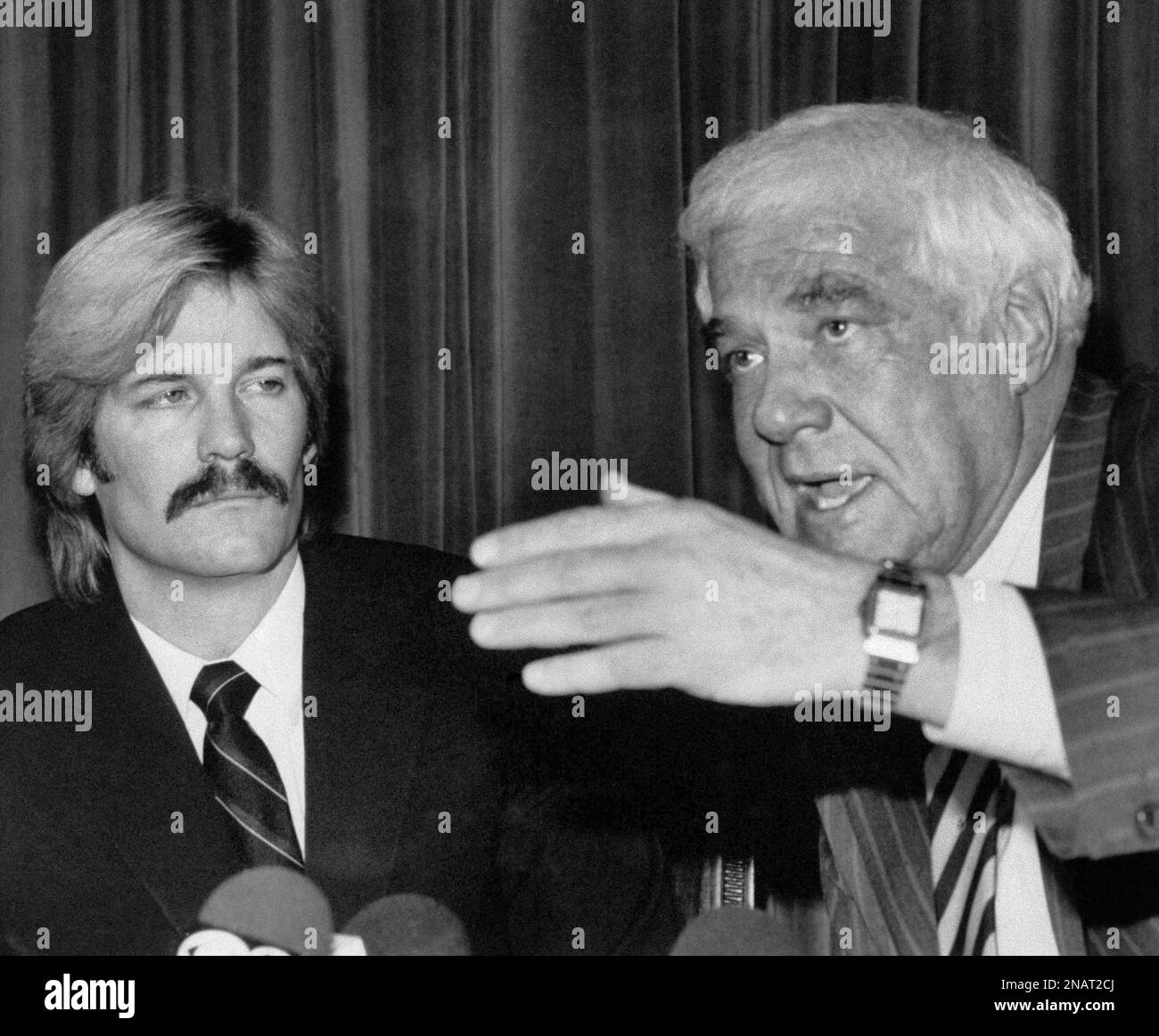 Marc Christian, left, listens as his attorney, Marvin Mitchelson ...