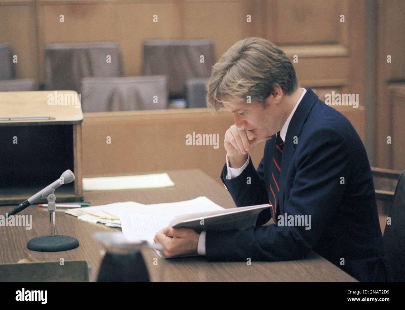 Marc Christian, Rock Hudson’s former lover, reads over legal documents ...