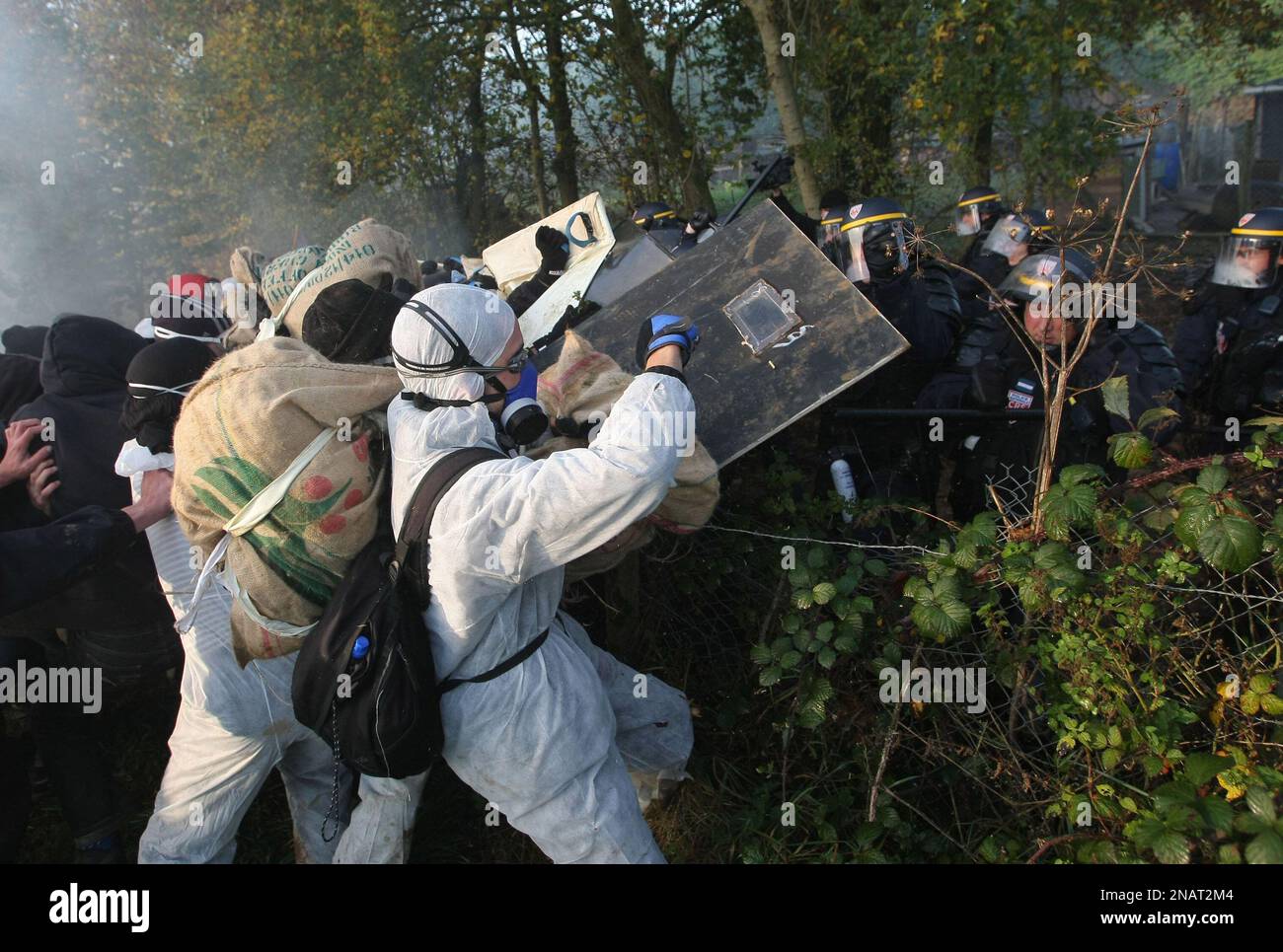 Activists clash with riot police officers early Wednesday, Nov. 23 ...