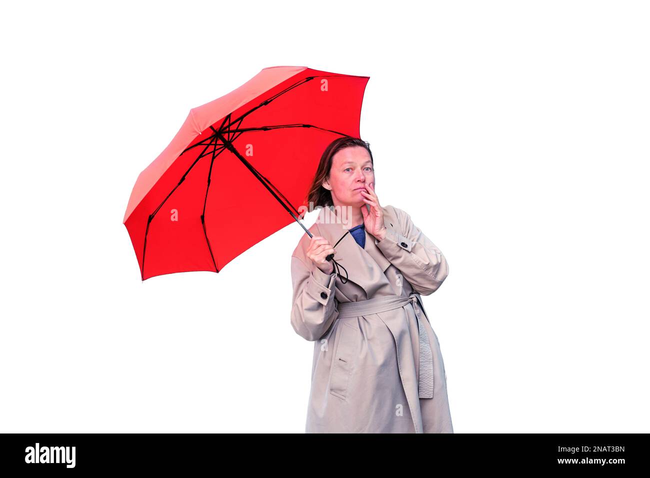 A brooding woman with a red umbrella, isolated on a white background ...