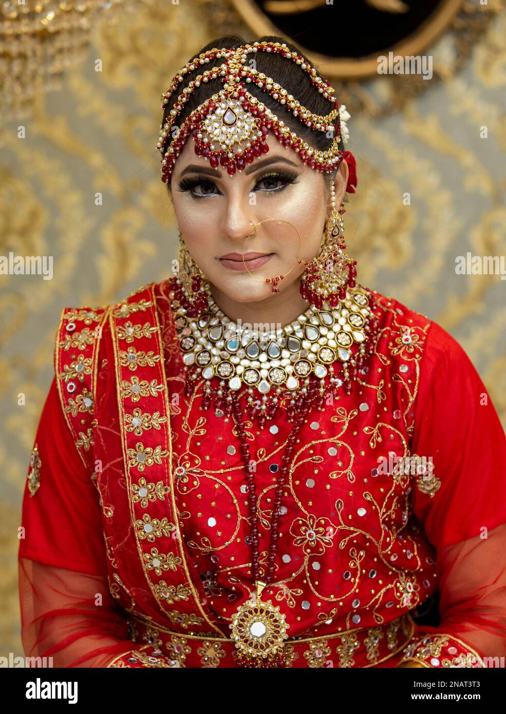 Indian and Pakistani bride dressed in traditional wedding clothes Stock ...