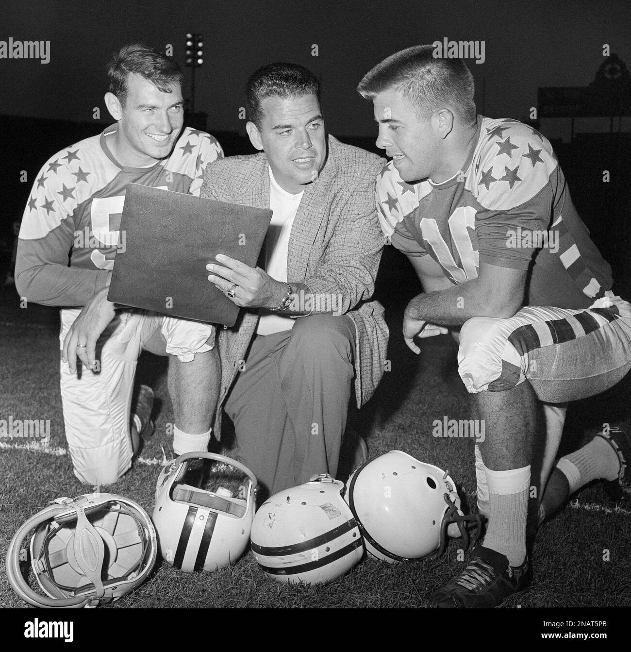 Coach Otto Graham, center, of the College All Stars football team ...
