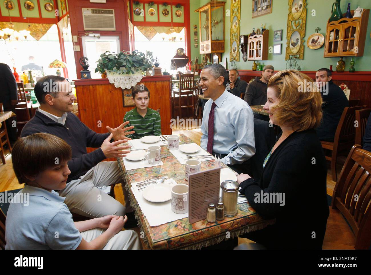 President Barack Obama meets with the Chris and Kathy Corkery, and ...