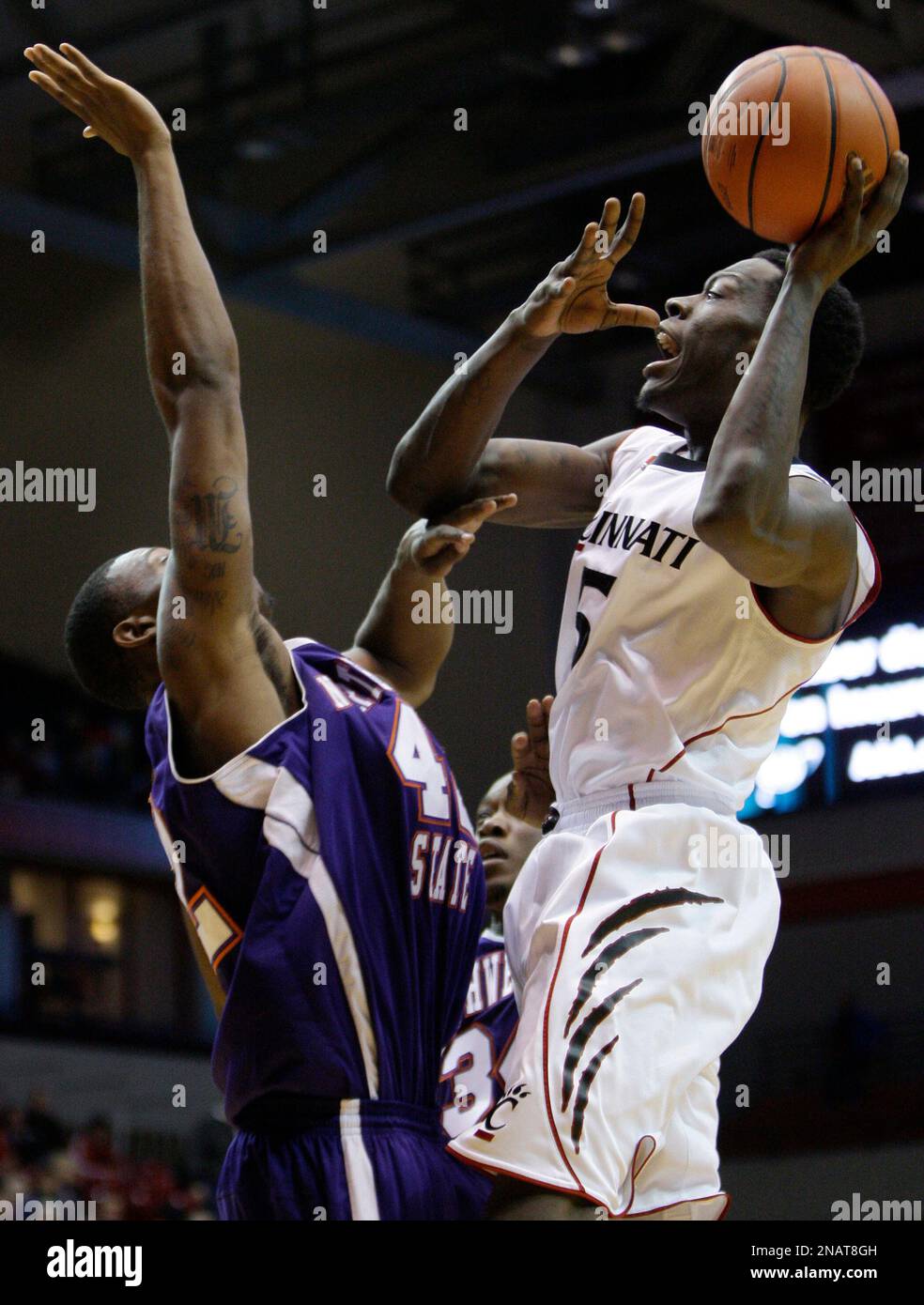 Cincinnati forward Justin Jackson, right, shoots against Northwestern ...