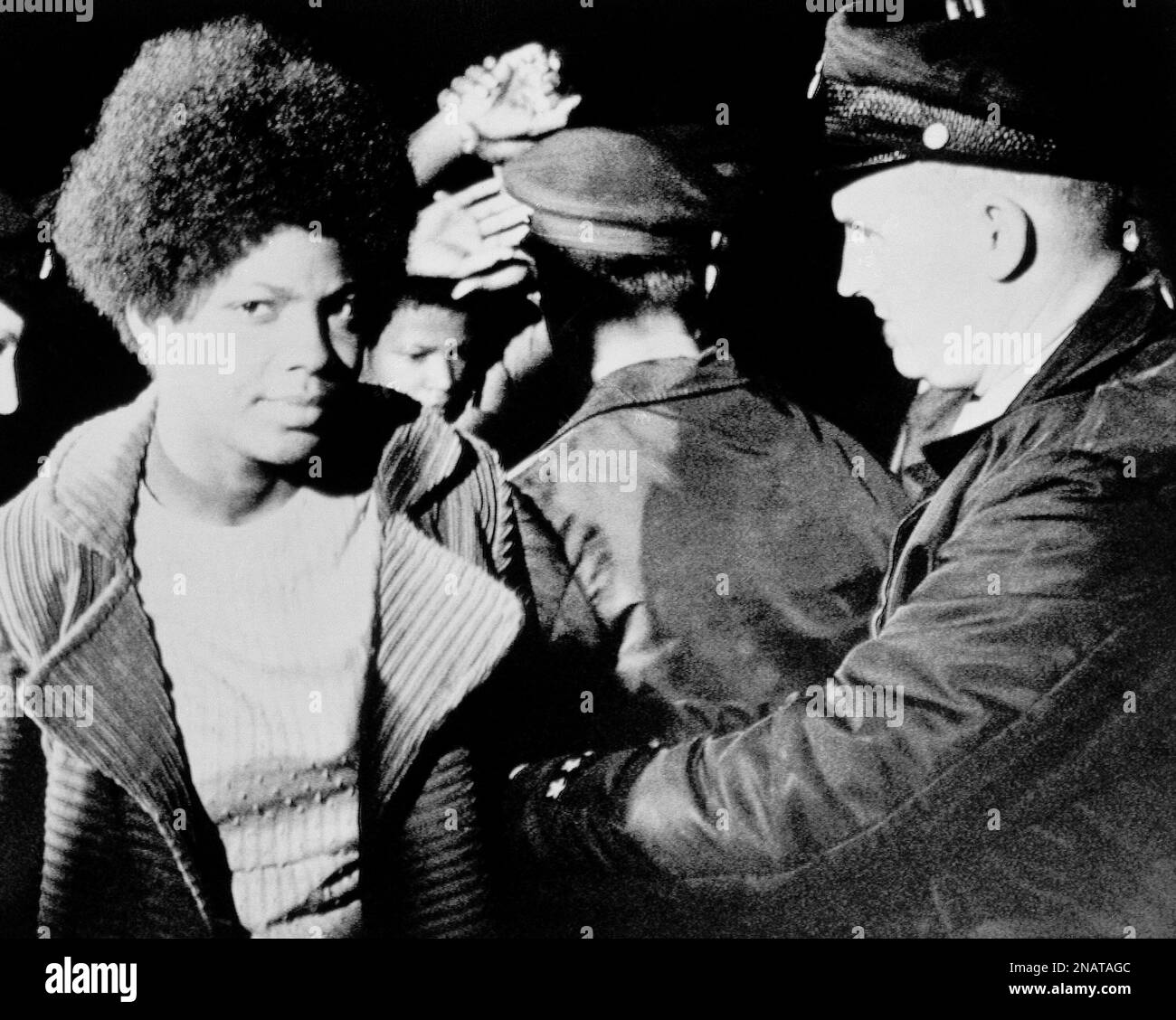 Detroit policemen search some of the 15 members of a Black Panther ...