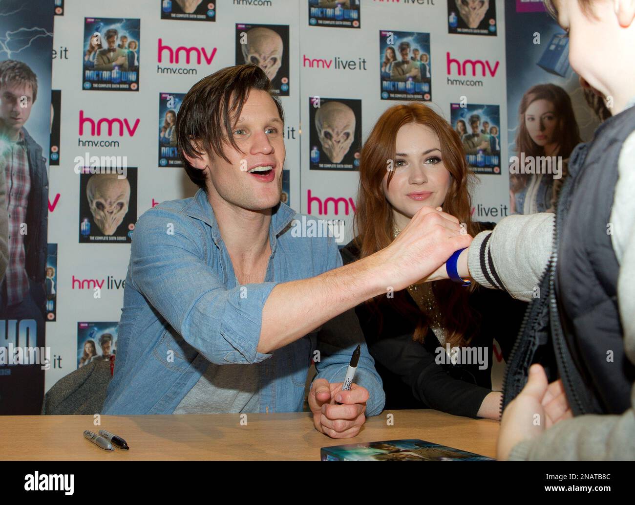 British actor Matt Smith greets a young fan at a London store as he ...