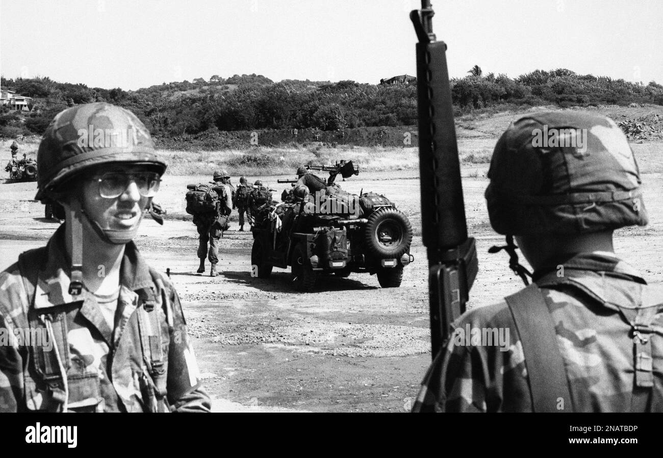 Members of the 82nd Airborne Division head in the direction of the town ...