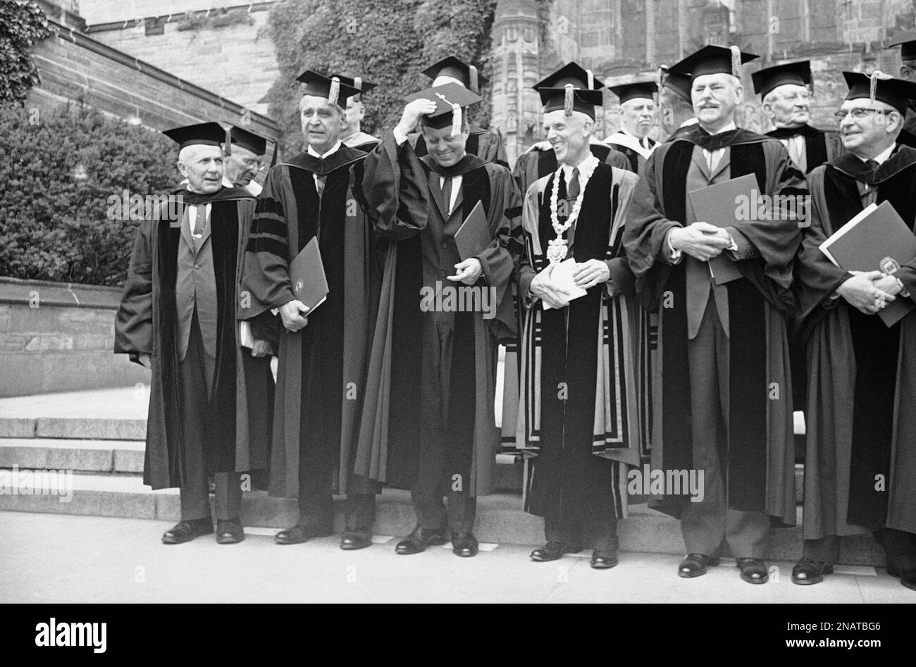 President John F. Kennedy, Harvard ’40, smilingly catches his slipping ...