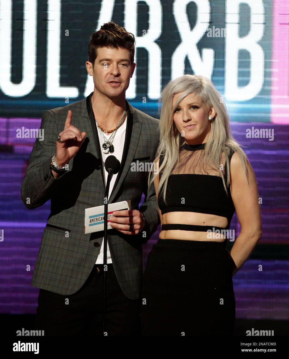 Robin Thicke, left, and Ellie Goulding present the award for soul/R&B ...