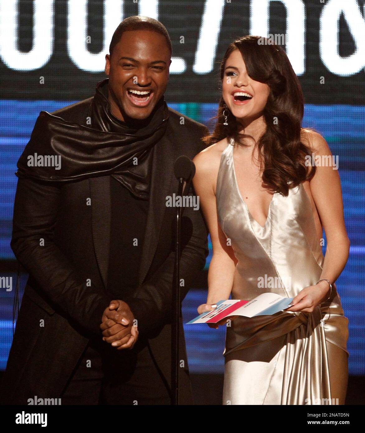 Taio Cruz, left, and Selena Gomez are seen onstage at the 39th Annual ...