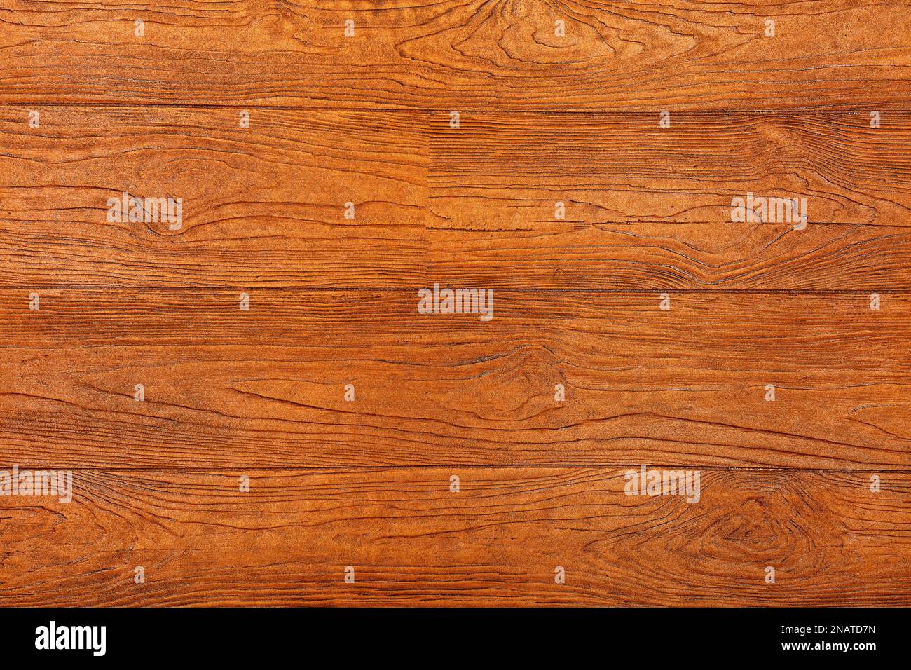 Wooden orange boards fit snugly horizontally to each other with a ...