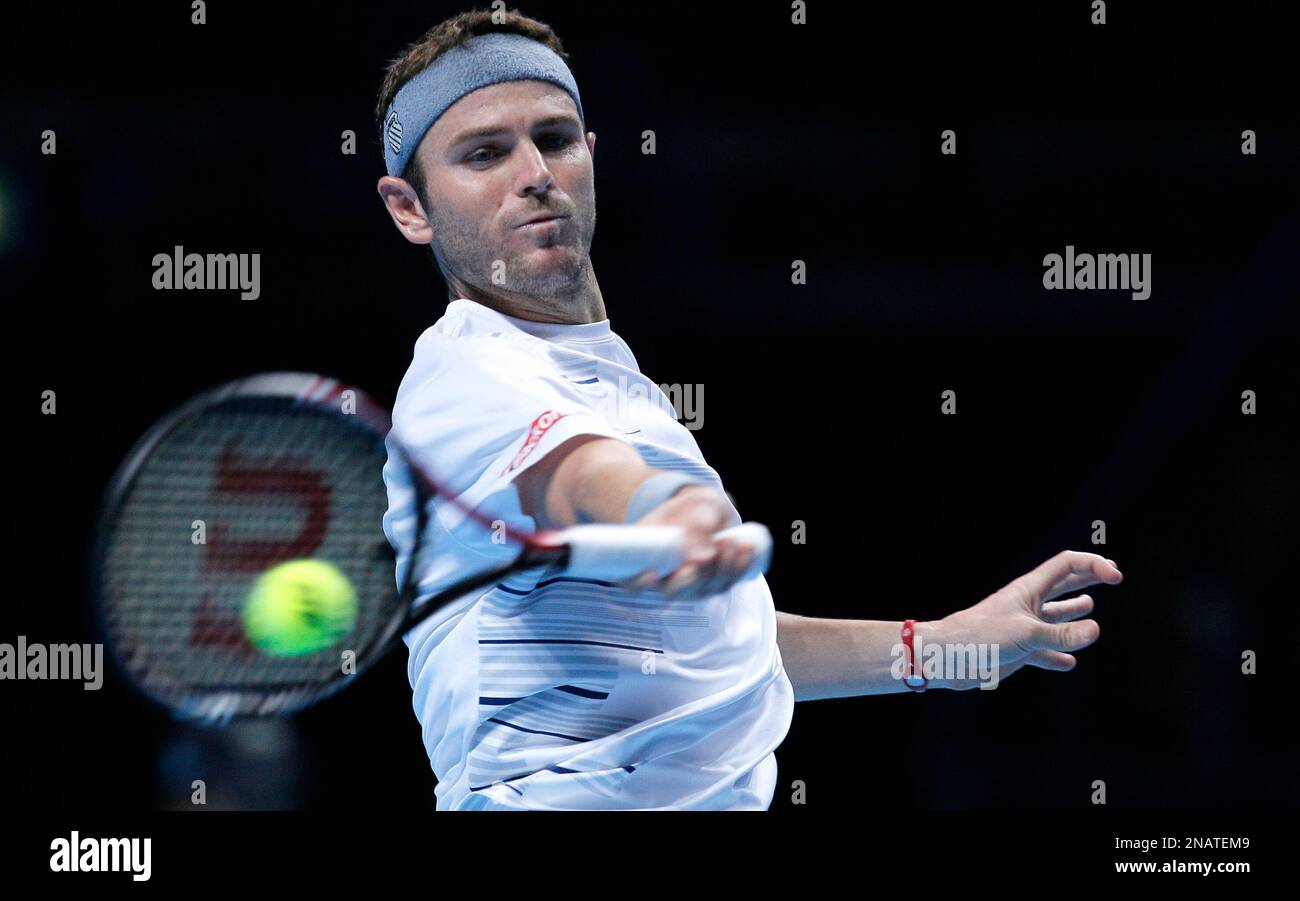Mardy Fish of the U.S. plays a return to Rafael Nadal of Spain during ...