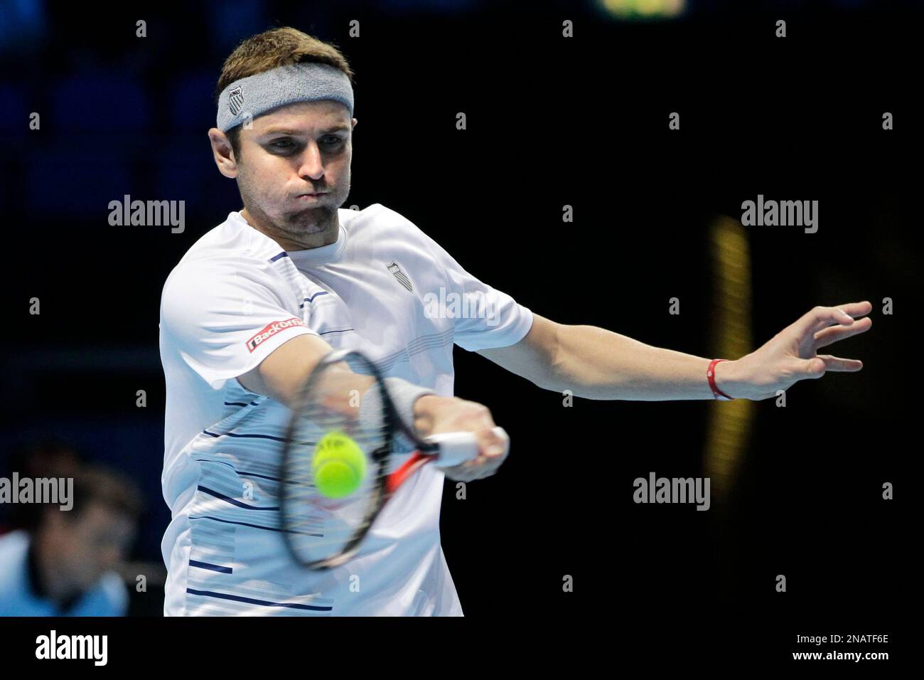 Mardy Fish of the U.S. plays a return to Rafael Nadal during a round ...