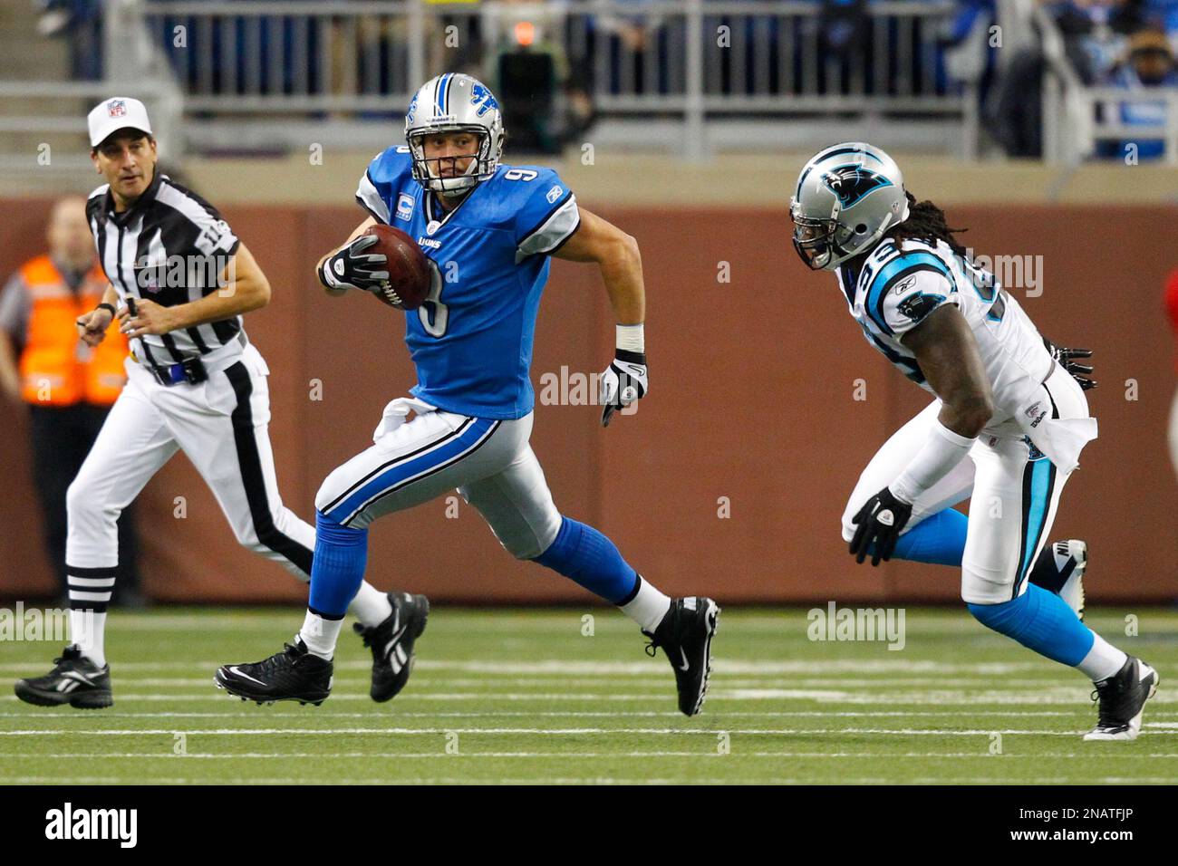 Detroit Lions quarterback Matthew Stafford (9) rolls out as Carolina ...