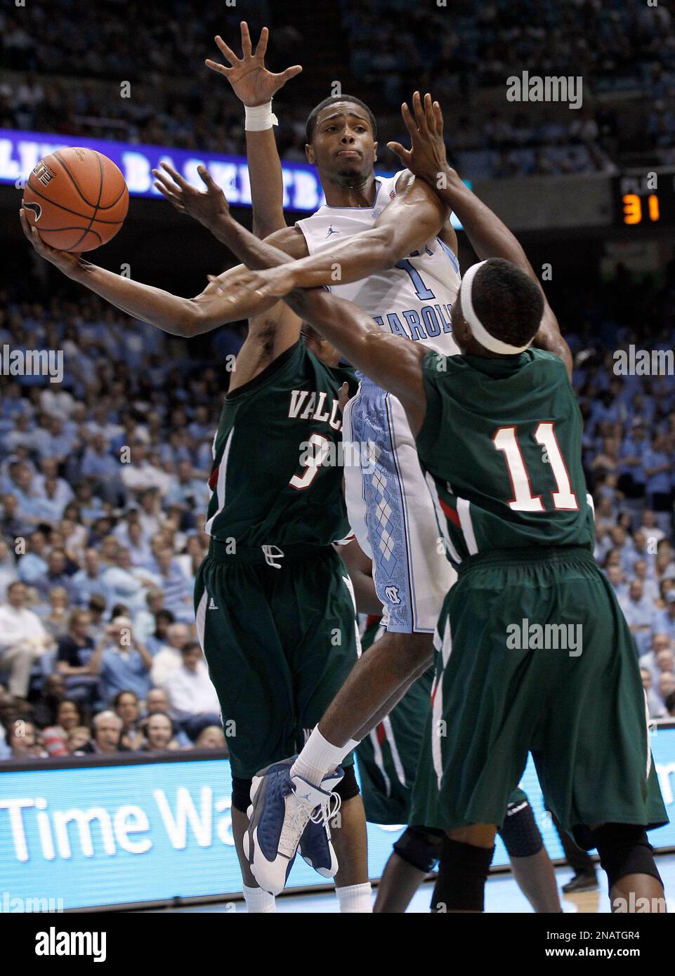 North Carolina's Dexter Strickland (1) passes around Mississippi Valley ...