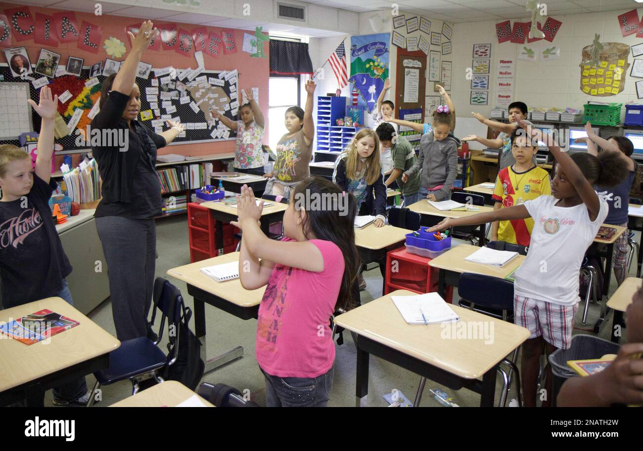 In this Monday, May 2, 2011, photo, Renata Brown works with students in ...