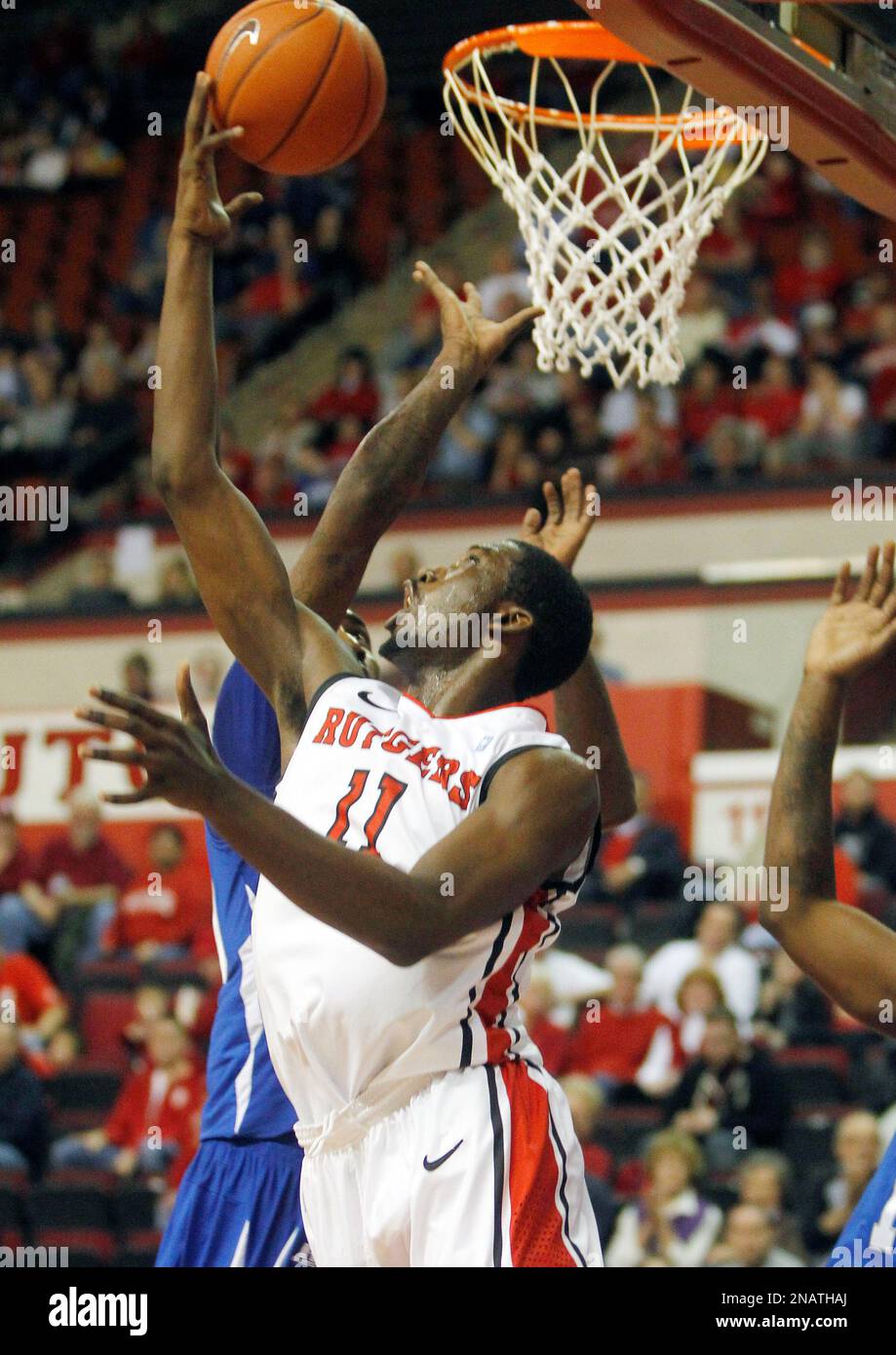 Rutgers' Dane Miller (11) takes a shot as Hampton's David Bruce (30 ...