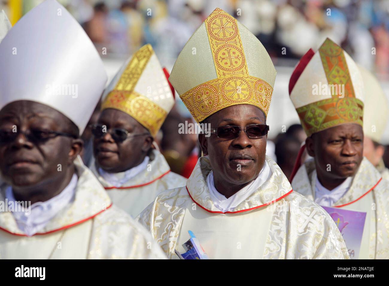 African members of the clergy arrive for Sunday Mass with Pope Benedict ...