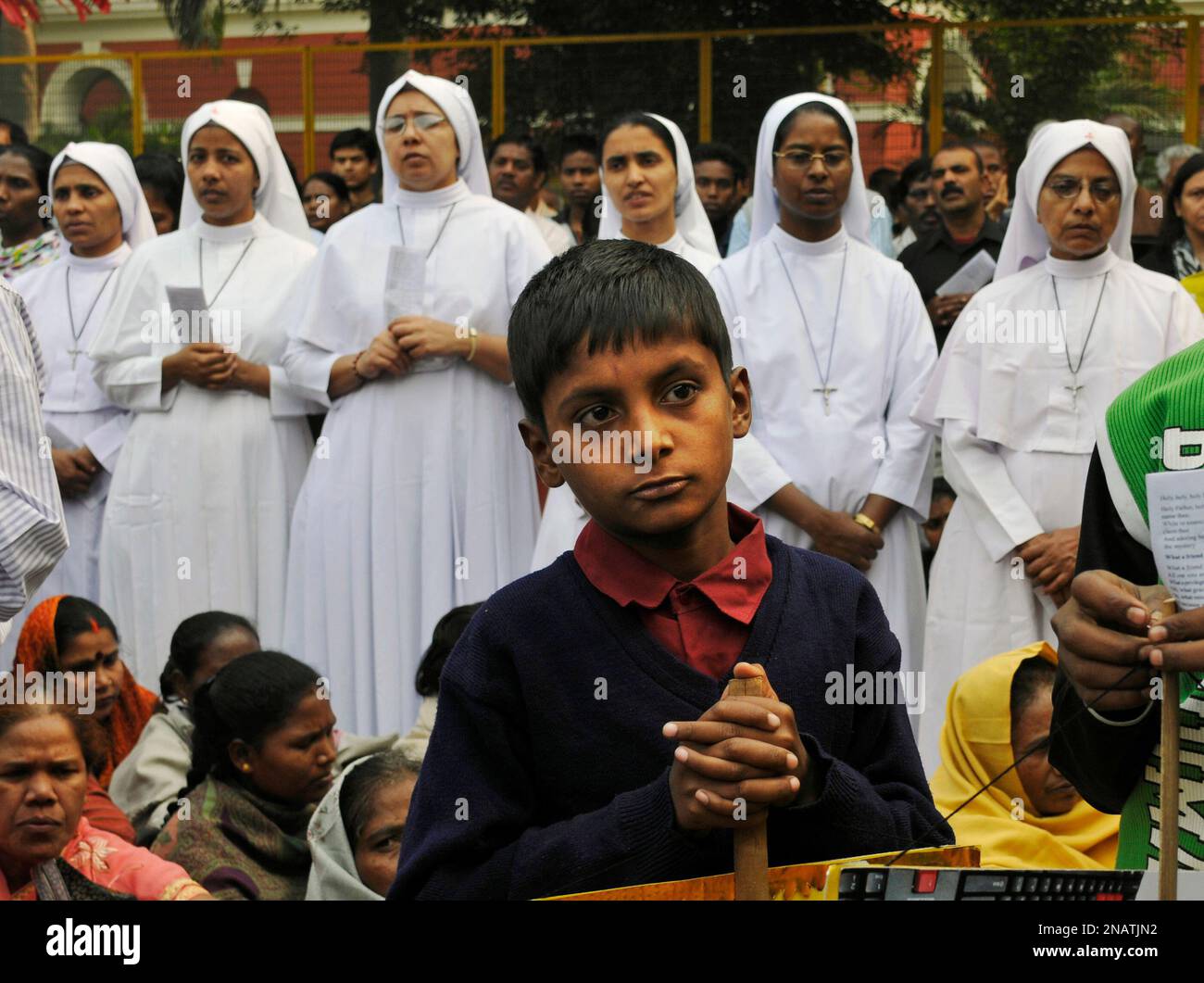 Indian Catholics participate in a prayer to mark ''the feast of Christ ...
