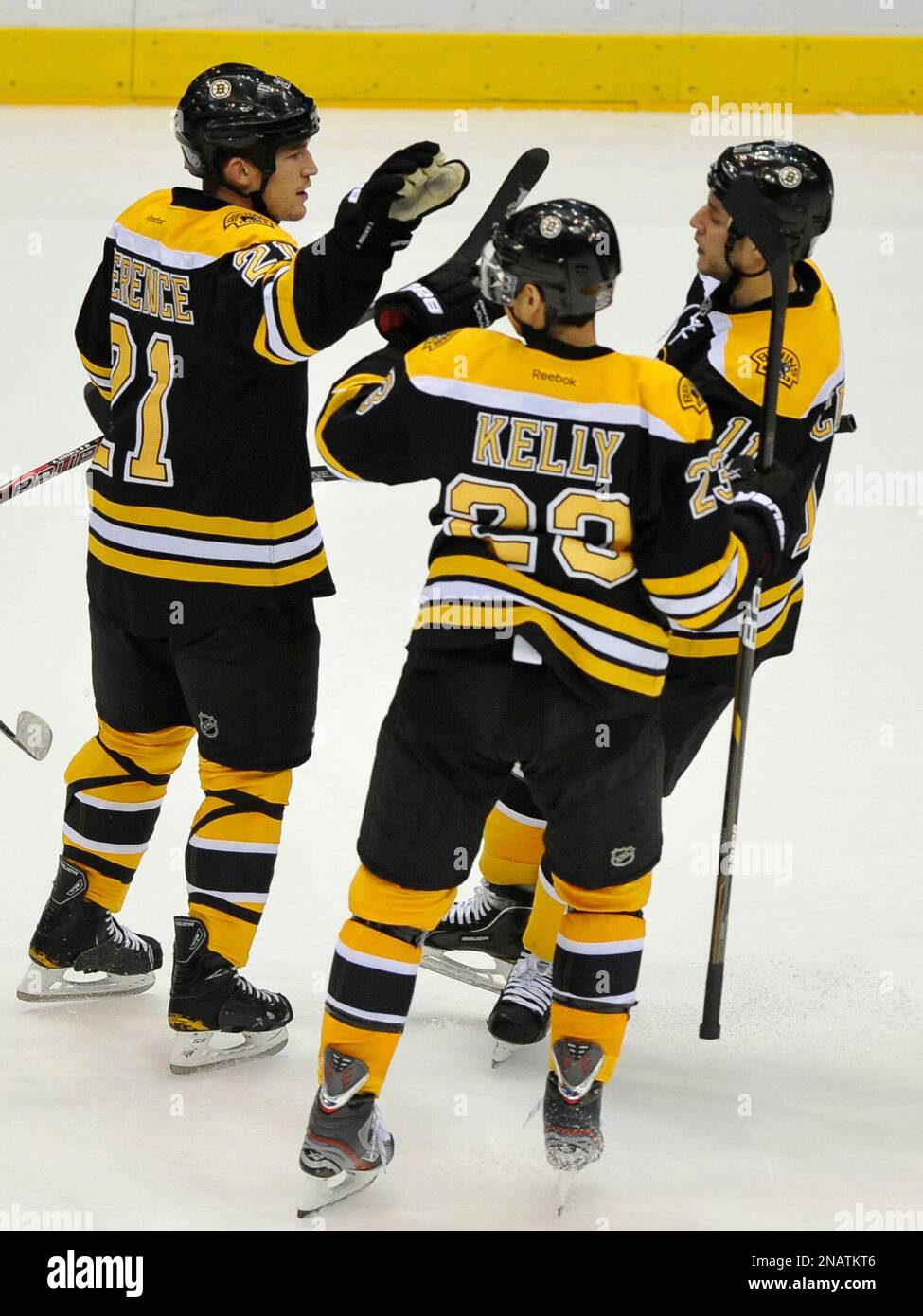 Boston Bruins' Andrew Ference (21), Chris Kelly (23) and Gregory ...