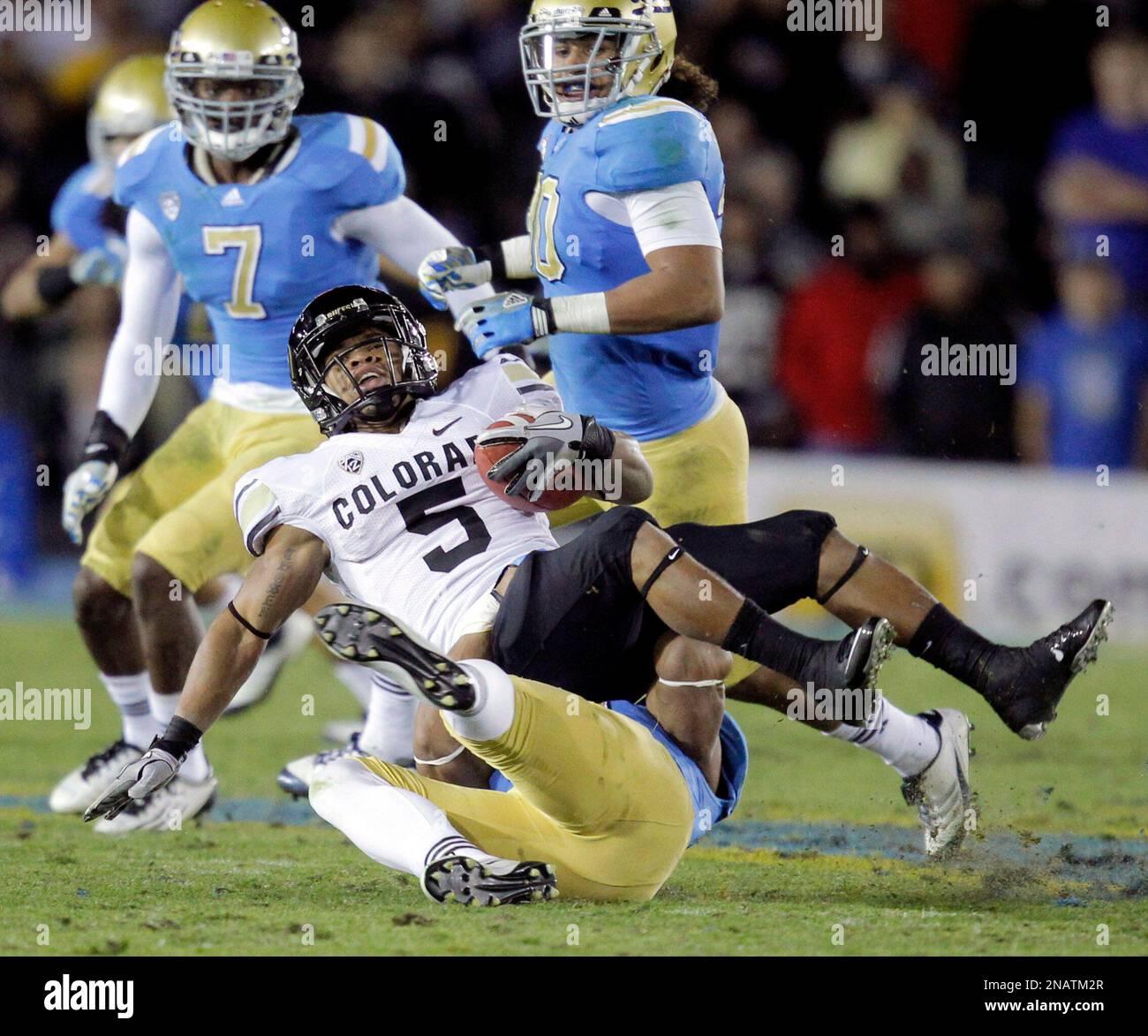 Colorado running back Rodney Stewart (5) is tackled by UCLA safety ...