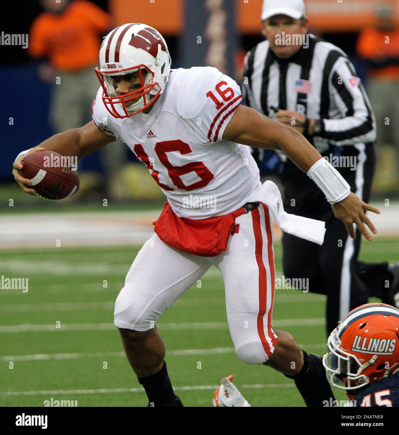 Wisconsin quarterback Russell Wilson (16) scramble out of the pocket ...