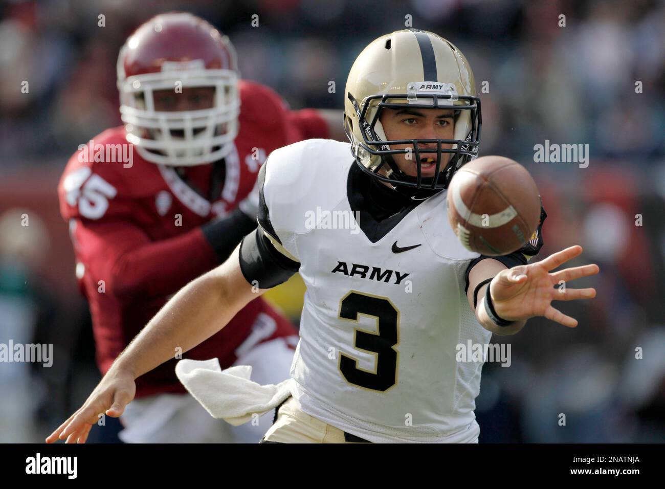Army Black Knights quarterback Angel Santiago (3) pitches the ball as ...
