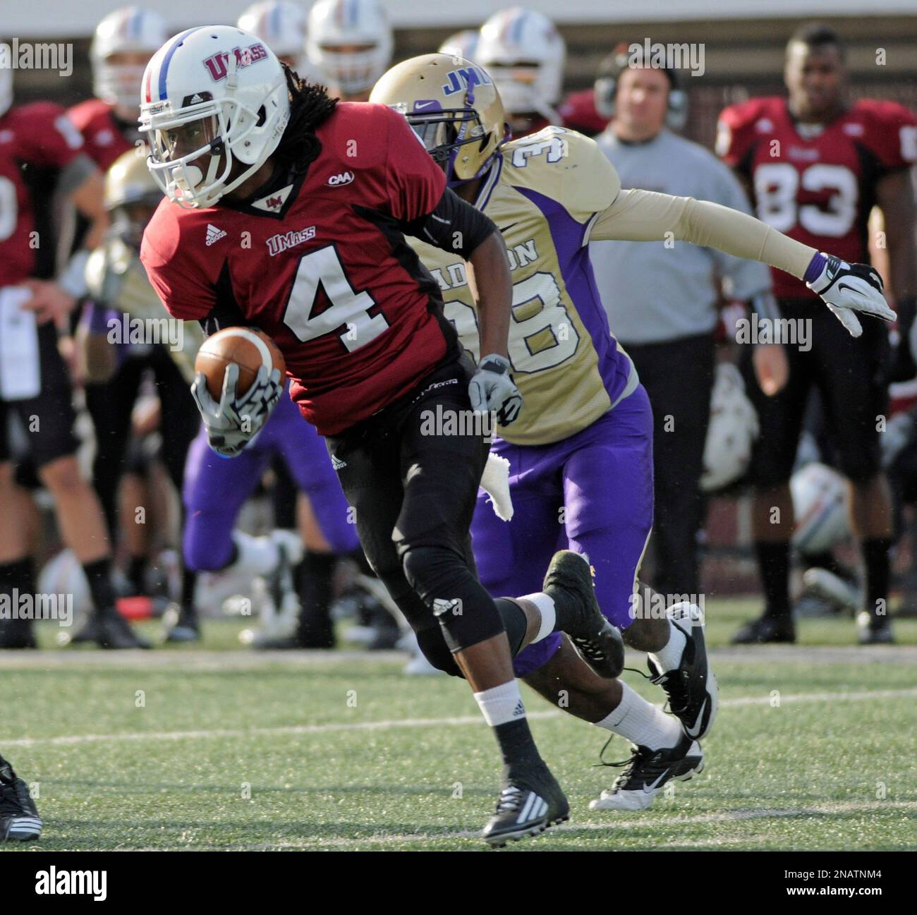 Massachusetts' Jesse Julmiste (4) runs ahead of James Madison's Jon ...