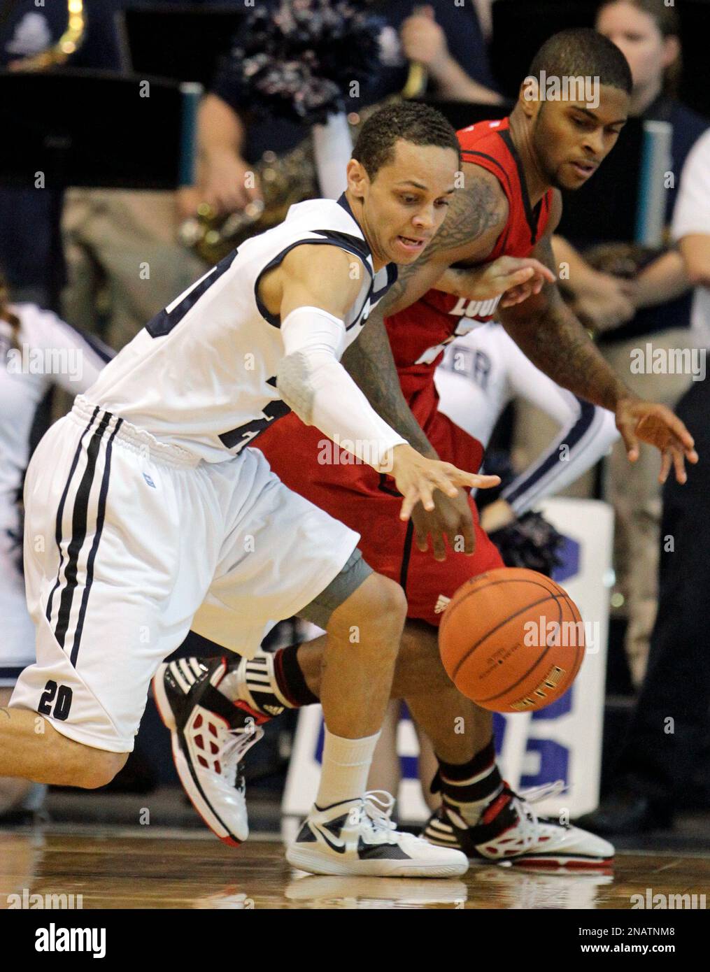 Butler's Chrishawn Hopkins, left, battles with Louisville's Chane ...