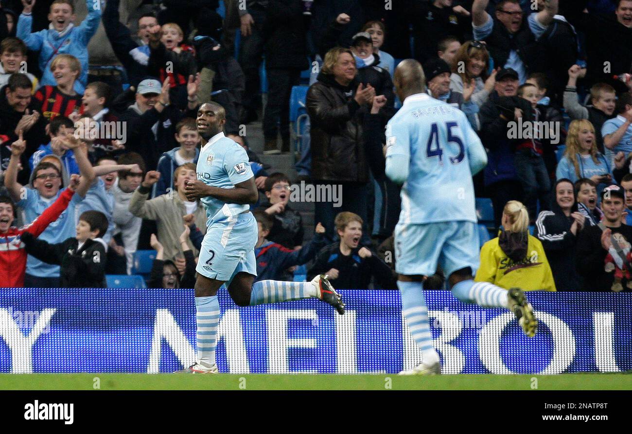 Manchester City's Micah Richards, left, celebrates after scoring ...