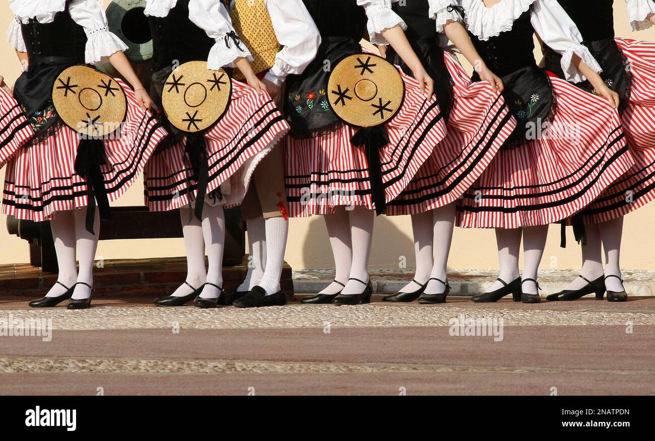 Children in traditional dresses attend a ceremony at the Monaco palace ...
