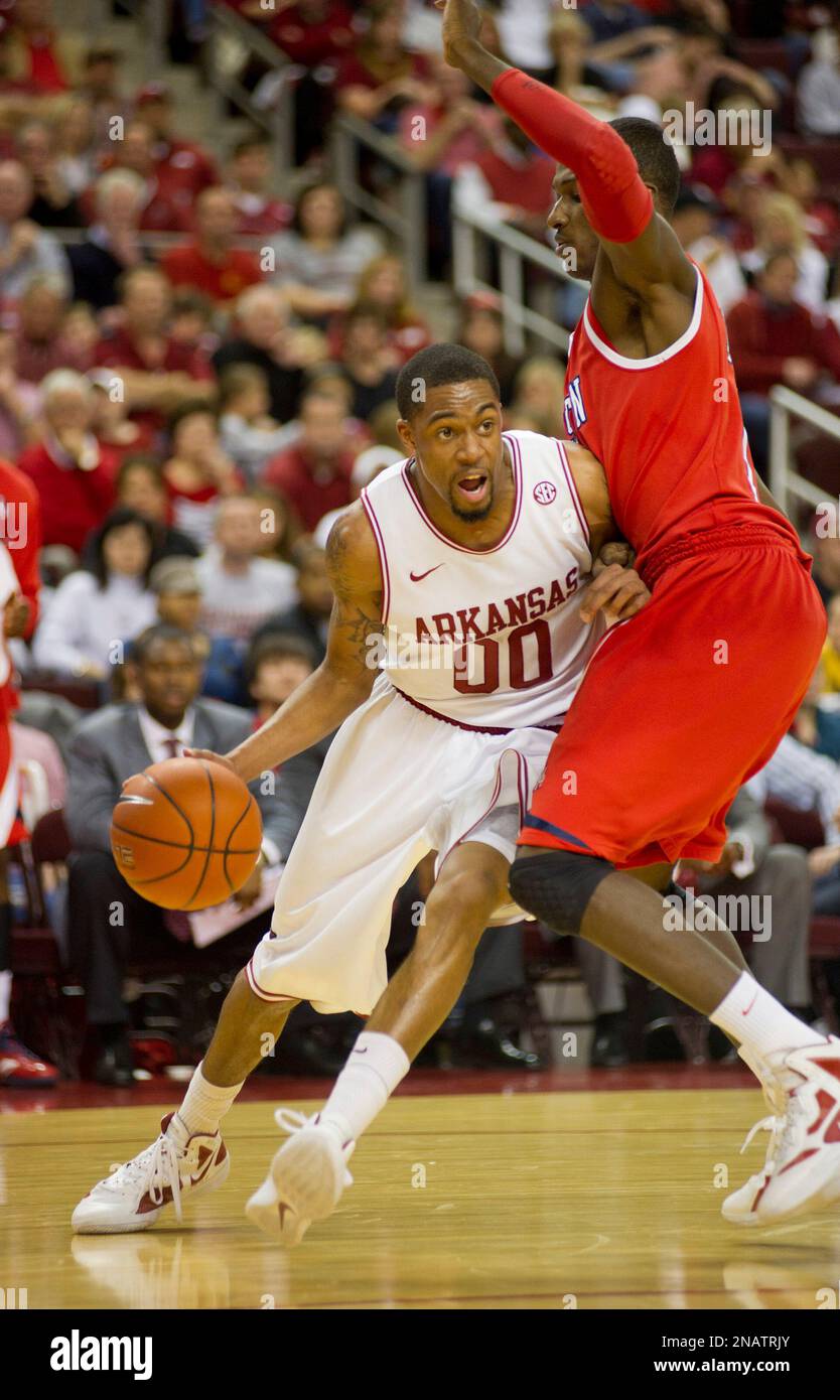 Arkansas' Rashad Madden (00) drives against Houston's Mikhail McLean ...