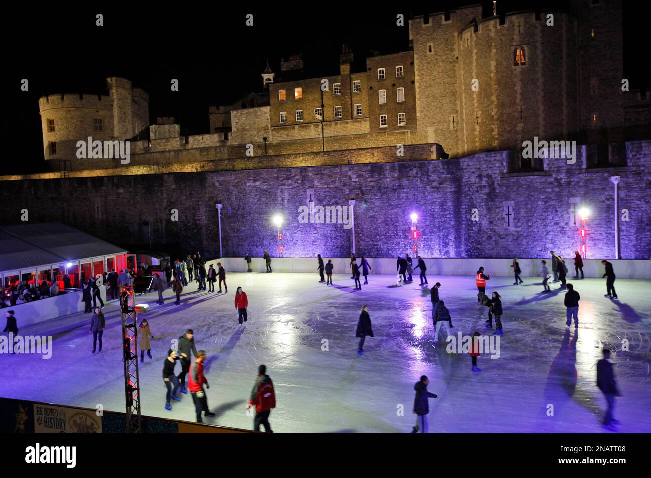 Skaters enjoy playing on the ice rink which has been set up in the moat ...