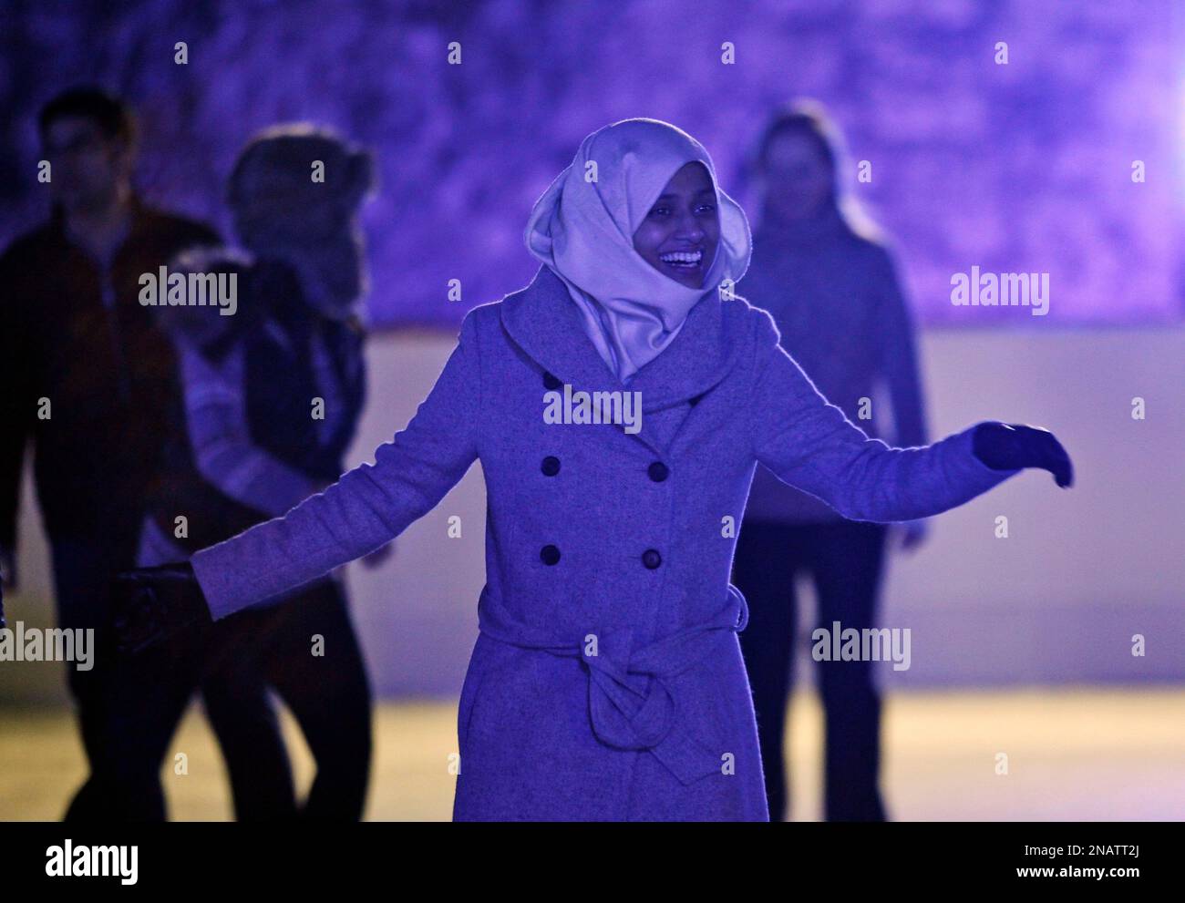 Skaters enjoy playing on the ice rink which has been set up in the moat ...