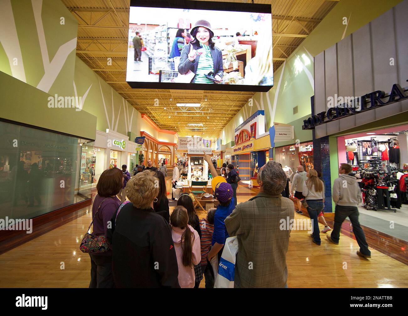 People watch AMNtv screens Friday, November 18, 2011 at Concord Mills ...