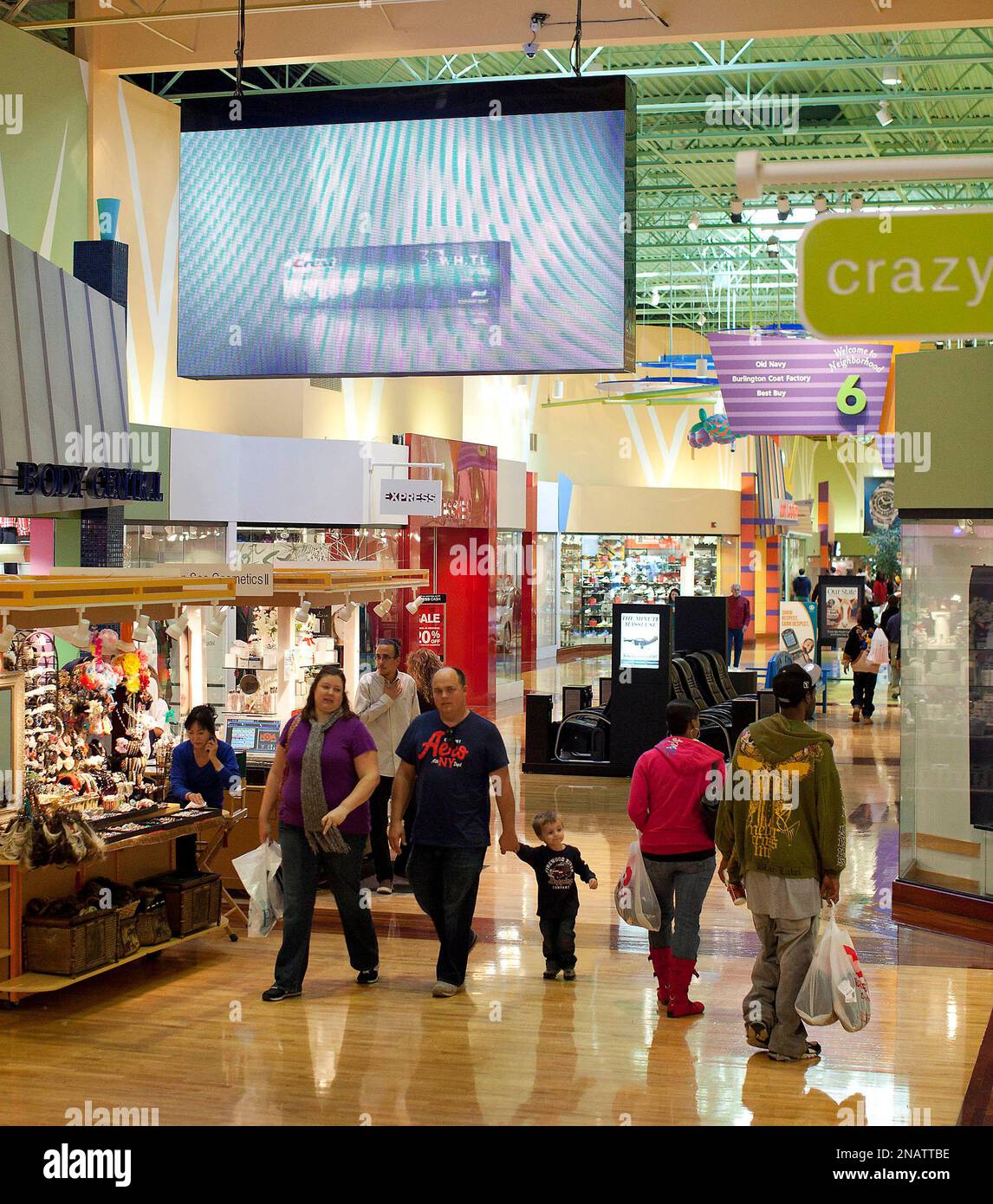People watch AMNtv screens Friday, November 18, 2011 at Concord Mills ...