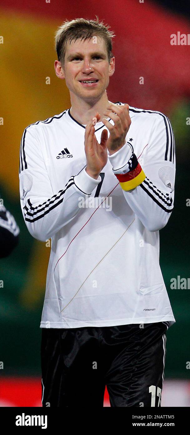Germany's Per Mertesacker applauds after a friendly soccer match ...