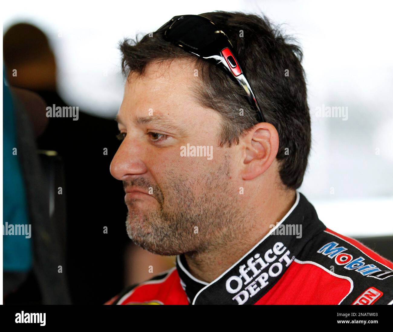 Driver Tony Stewart talks to crew members before practice at the ...