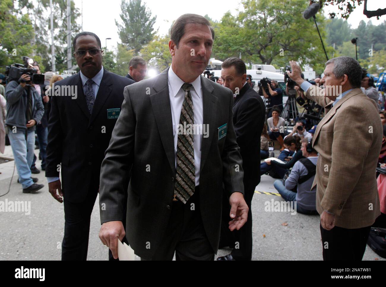 Lt. John Corina, center, of the Los Angeles County Sheriff's Department ...
