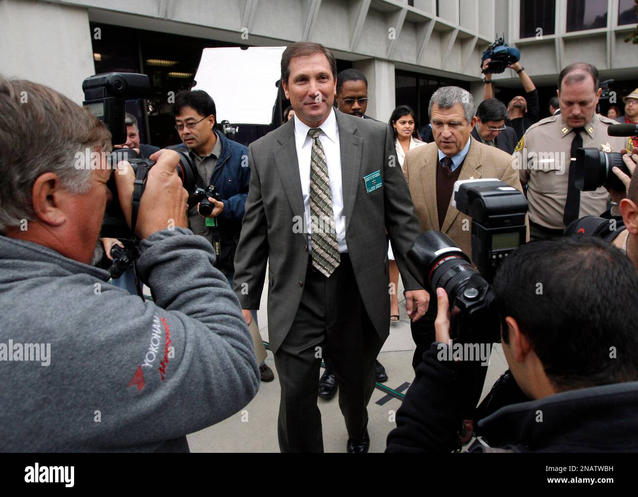 Lt. John Corina, center, of the Los Angeles County Sheriff's Department ...